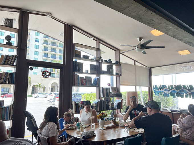 Community happens naturally here&mdash;tables filled with conversations, connections, and the shared language of good food in sunlit surroundings.