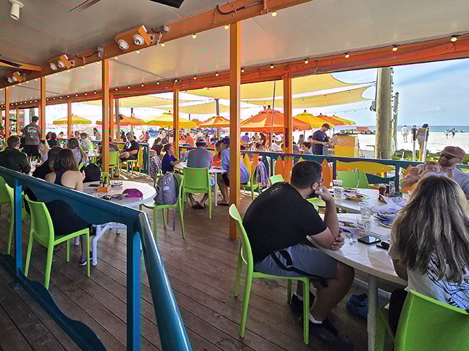Dining with a side of vitamin sea! Happy patrons soak up ocean views and seafood delights under the watchful gaze of the Gulf's endless horizon.