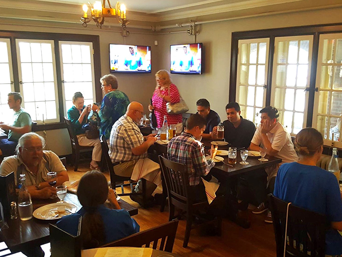 Multi-generational gatherings around wooden tables prove that good German food brings people together better than any social media platform ever could.