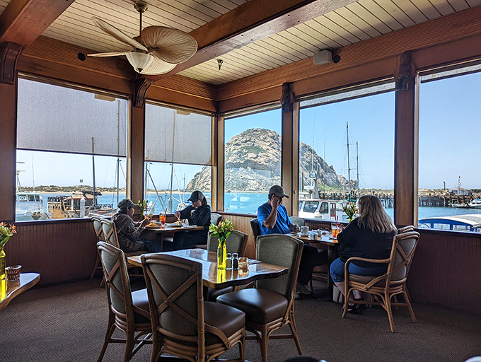 The million-dollar view of Morro Rock through panoramic windows turns every table into the best seat in the house.