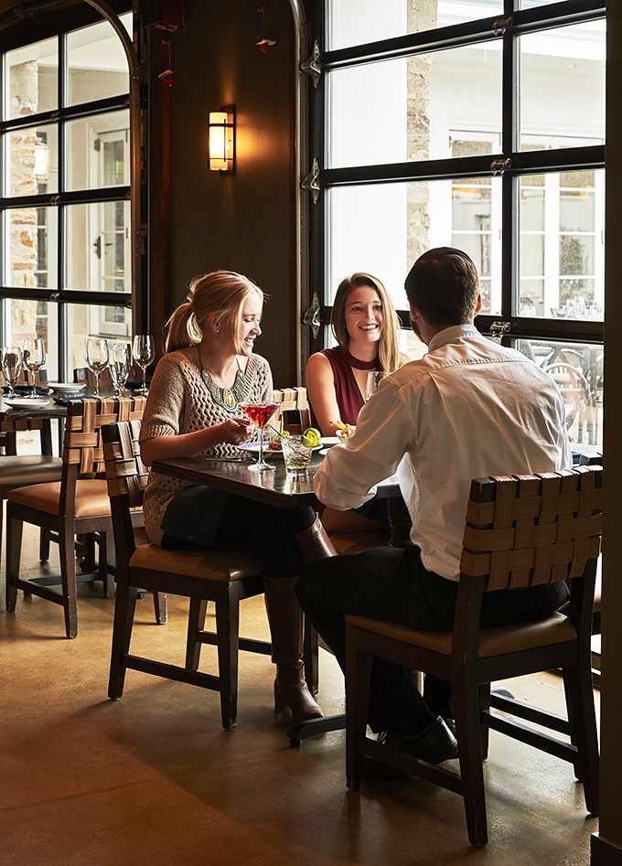 The best conversations happen over craft cocktails in spaces designed for lingering. Notice how nobody's checking their phones? That's the magic.