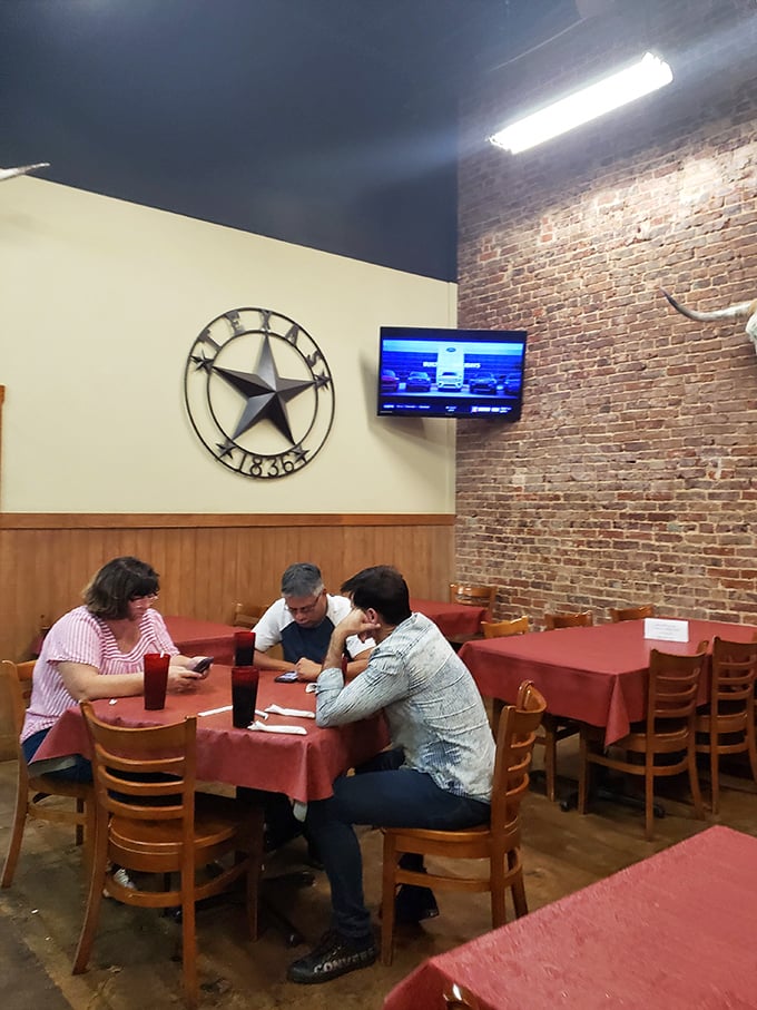 Diners huddle around red-clothed tables beneath the watchful eye of the Texas star, plotting their next menu conquest.
