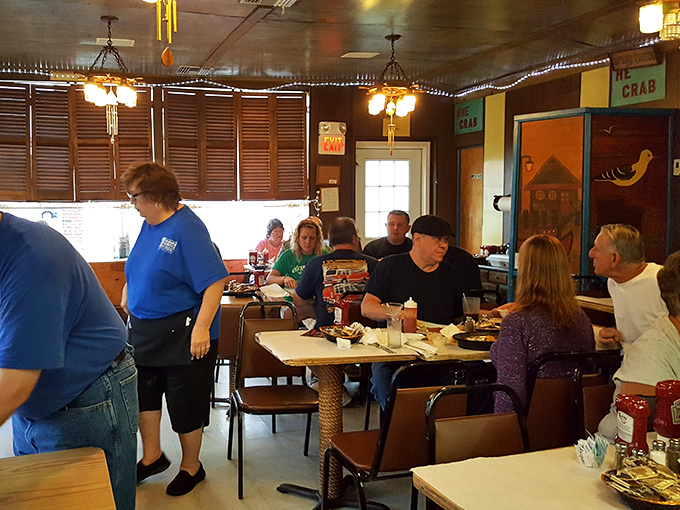 Where strangers become friends over shared love of seafood. Notice the complete absence of phones &ndash; everyone's too busy enjoying their meal.