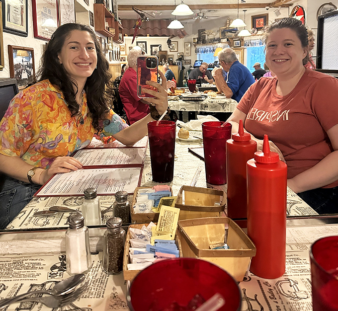 The true measure of a great restaurant: happy diners making memories over red plastic cups of sweet tea and newspaper-covered tables.