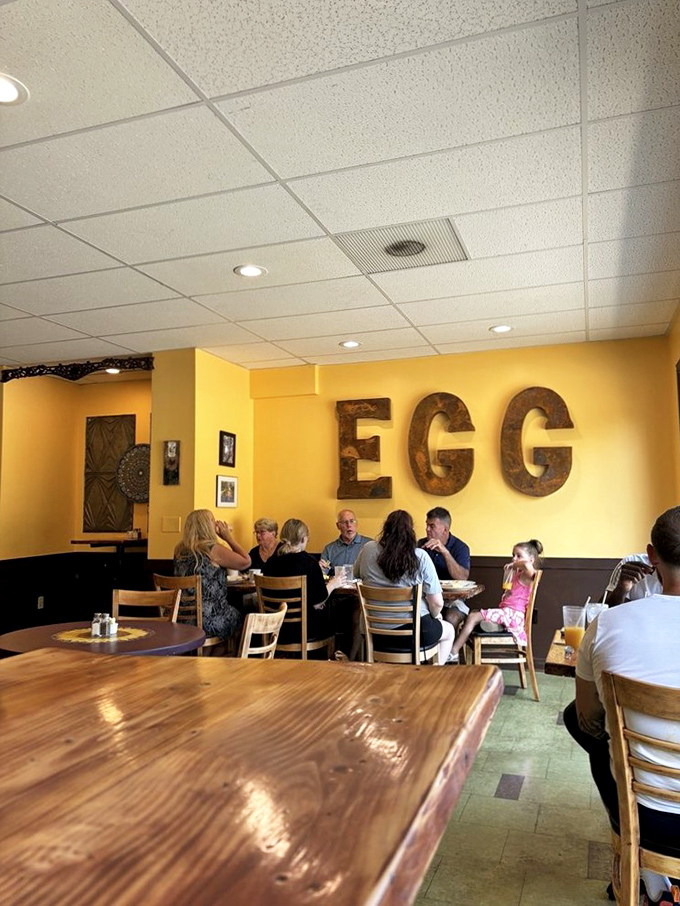 Where breakfast memories are made: families gathering under the watchful gaze of those iconic wooden "EGG" letters that have witnessed countless "pass the syrup" requests.