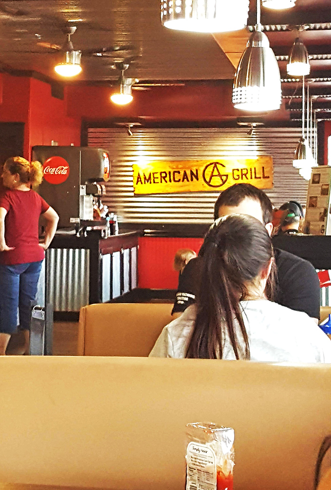 The true measure of any great BBQ joint: regular folks gathered around tables, focused on the serious business of enjoying every last bite.