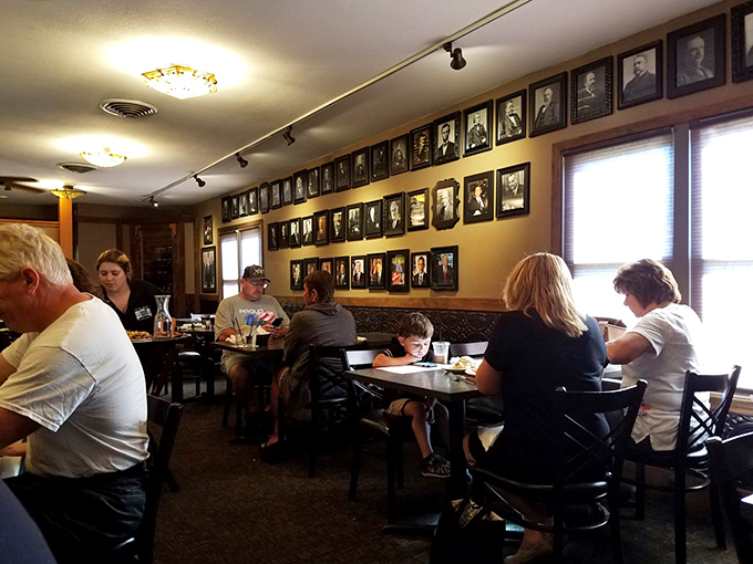 The wall of history watches over diners enjoying meals worth remembering. Some restaurants have atmosphere; this one has character.