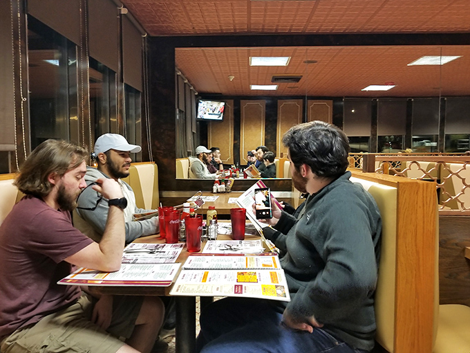 Where strangers become temporary neighbors, united by the universal language of "pass the ketchup." Every booth holds a different chapter of life.