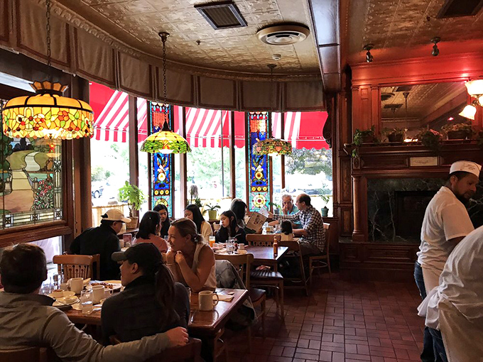 Where breakfast memories are made&mdash;diners savoring every bite while Tiffany lamps cast their warm glow over morning conversations.