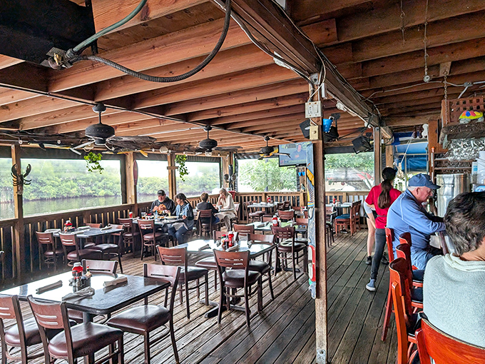The covered deck at Shrimper's&mdash;where conversations flow as smoothly as the water views, and nobody's checking their watch.