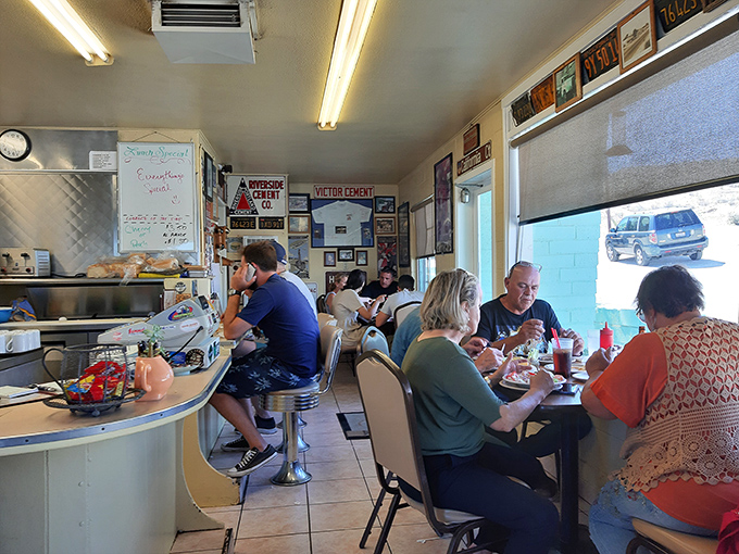 Real people enjoying real food in real booths - this is what authentic American dining looks like, folks. 