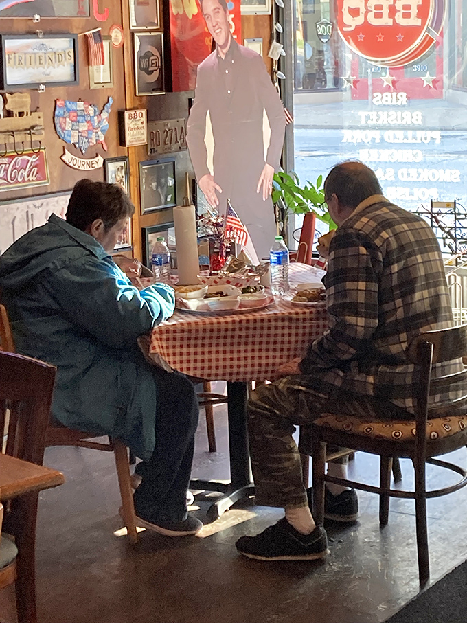 Even cardboard cutouts can't resist joining these diners. The red-checkered tablecloth signals you're in authentic territory&mdash;no fancy frills, just serious eating.