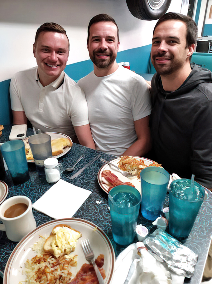 Happy faces around the table tell the real story&mdash;good food creates good memories, especially when blue glasses are involved.