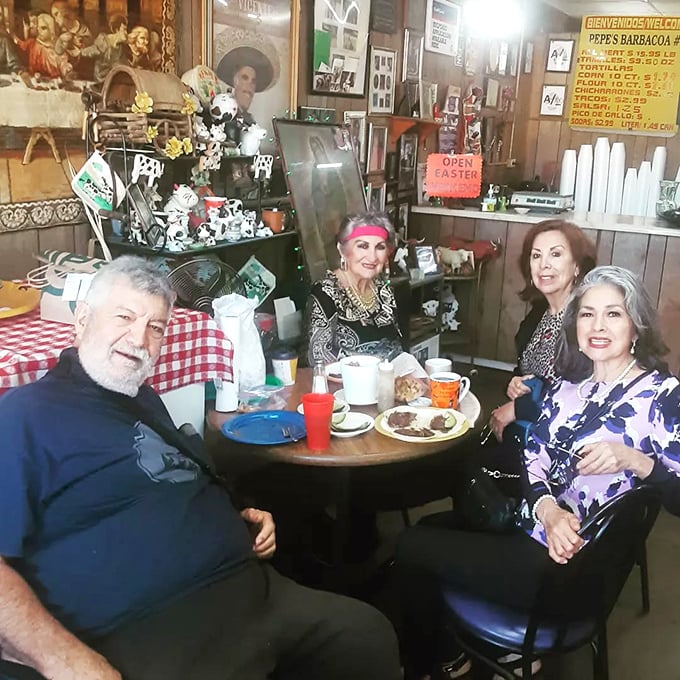 Happy customers enjoying their weekend barbacoa feast in the cozy, family-friendly atmosphere that defines this special place.