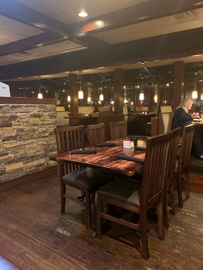 Stone accents and pendant lighting create the perfect backdrop for memorable meals. Comfort extends beyond just the food here.