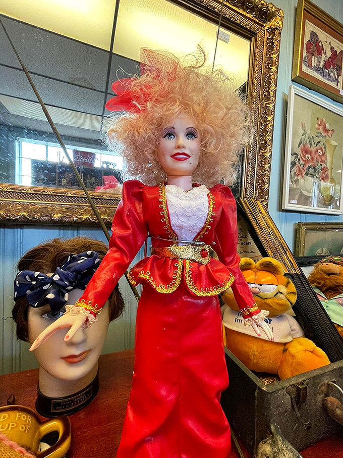With her wild hair and elaborate red ensemble, this vintage doll seems ready to tell stories of the children who once loved her.