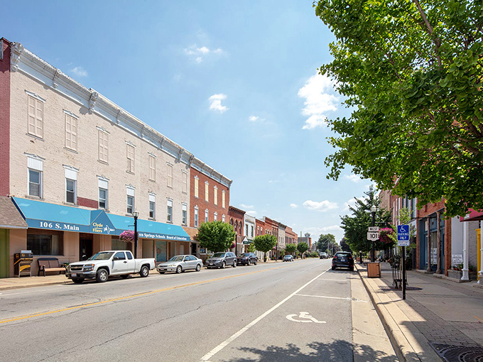 Sunlight bathes the historic storefronts along Main Street, where small businesses thrive and sidewalks invite leisurely strolls rather than hurried commutes.