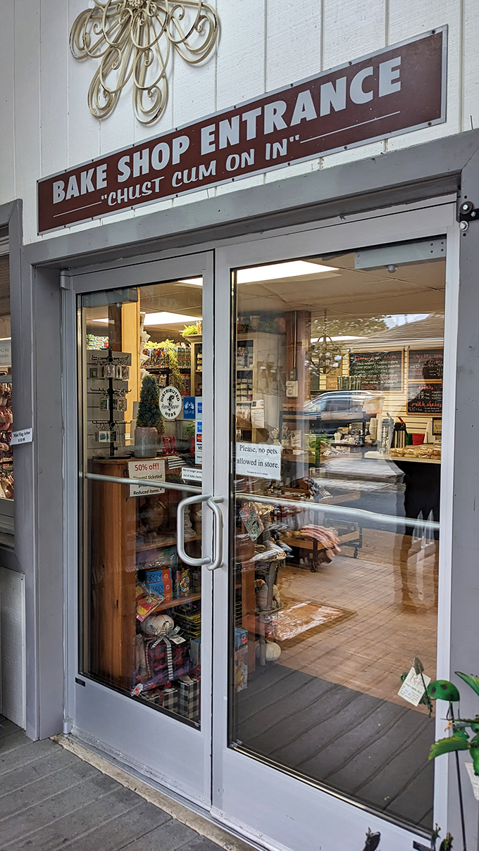 "Chuist cum on in" indeed! An entrance sign that perfectly captures both hospitality and the promise of carbohydrate bliss.