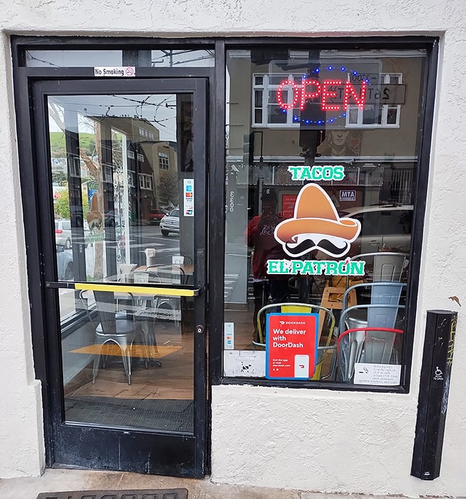 "Come in, we're open!" The entrance promises taco salvation with its glowing signs and that charming sombrero mascot watching over hungry pilgrims.