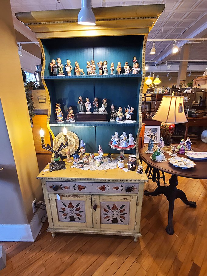 Figurines with stories to tell, displayed on a cabinet that's probably seen more history than your high school textbook ever covered.