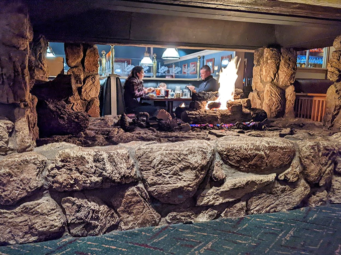 The stone fireplace creates a mountain lodge vibe that makes you want to order something rare and tell tall tales.