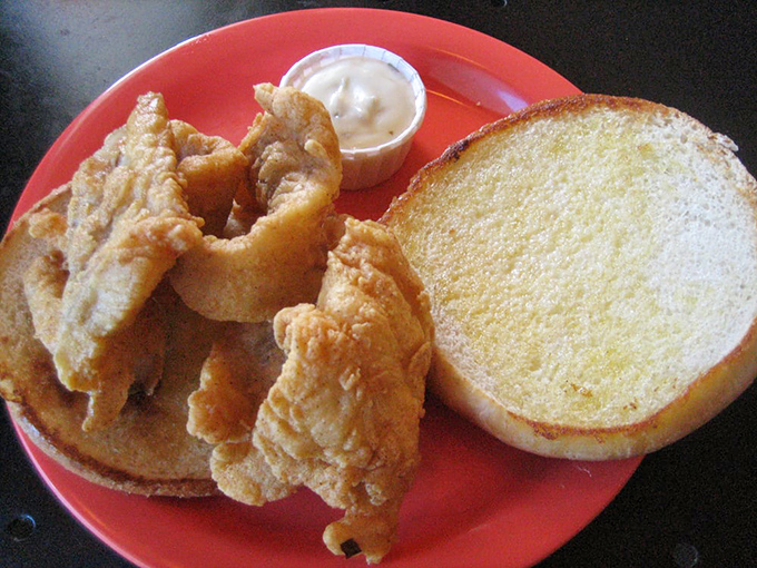 A sandwich that demands to be photographed before eaten. Between those toasted buns lies the promise of simple, perfect satisfaction.