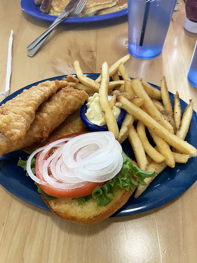 This isn't just a fish sandwich; it's architecture&mdash;golden-battered fish, fresh toppings, and fries that deserve their own fan club.