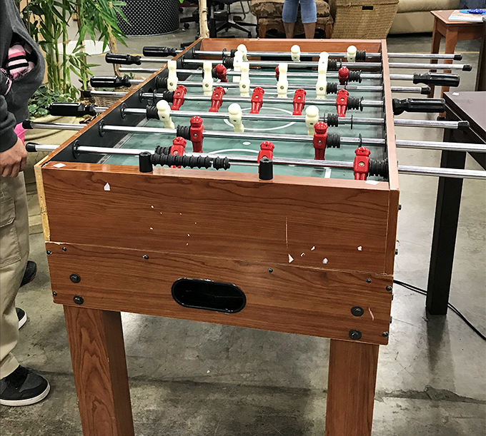 Game night gold! This foosball table has probably witnessed more family competitions than the Olympics. Slightly worn, completely wonderful.
