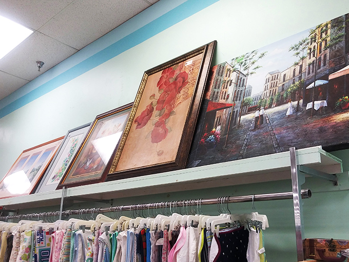 Wall art waiting for its forever home. That European street scene could transport your dining room to Paris without the airfare.