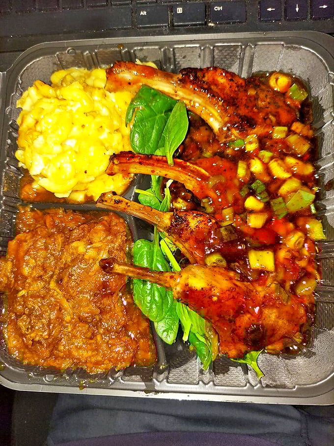 Lamb chops that look like they've been kissed by flavor gods, nestled beside mac and cheese that's achieving peak creaminess.