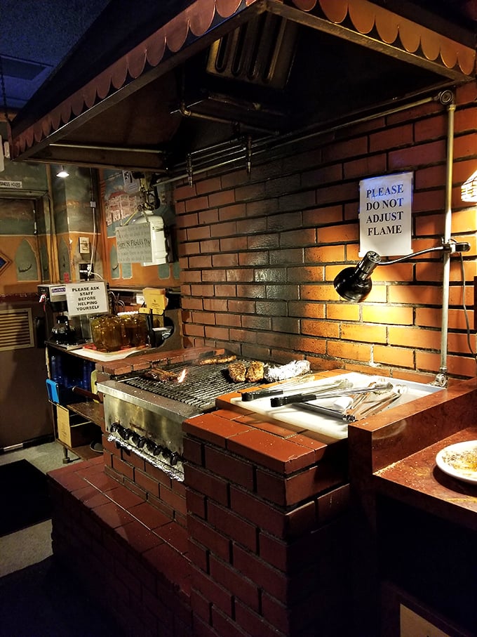 The heart of the Venice Room experience: a communal grill where CEOs and construction workers stand shoulder to shoulder.