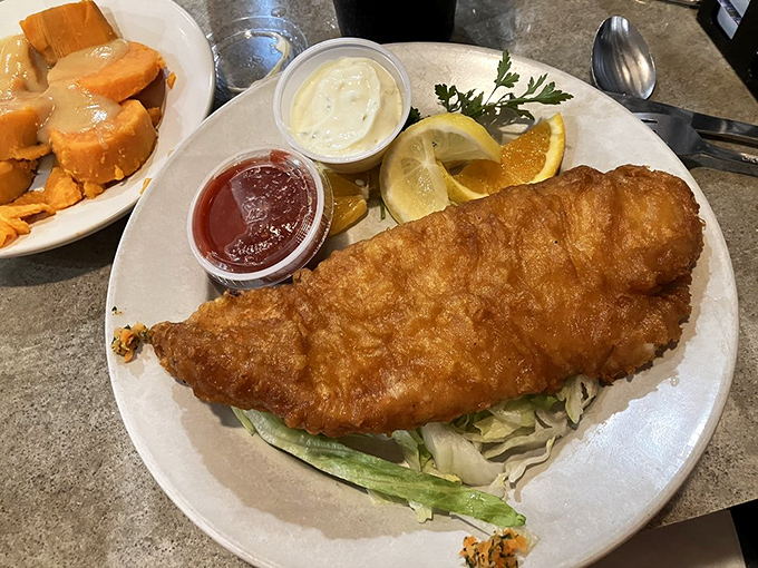 Fish so perfectly fried it deserves its own trophy. That golden crust is protecting treasures within like Fort Knox guards gold.
