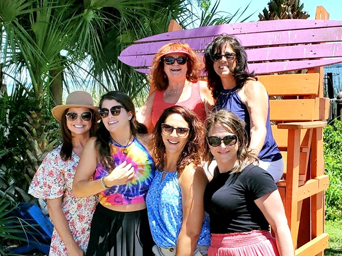 The colorful outdoor seating area provides the perfect backdrop for making memories with friends. Smiles included at no extra charge.