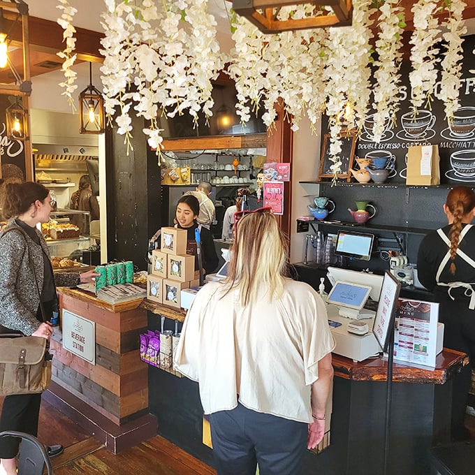 Under a canopy of white floral garlands, cafe magic happens as customers discover their next favorite drink or pastry obsession.