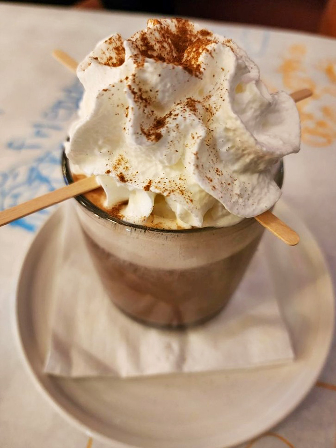This isn't just hot chocolate—it's a frothy tower of whipped cream and spice that makes you wonder why you ever settled for the powdered stuff.