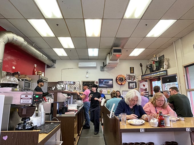 The breakfast ballet in full swing. Servers navigate the narrow space with the grace of dancers who've memorized every step.