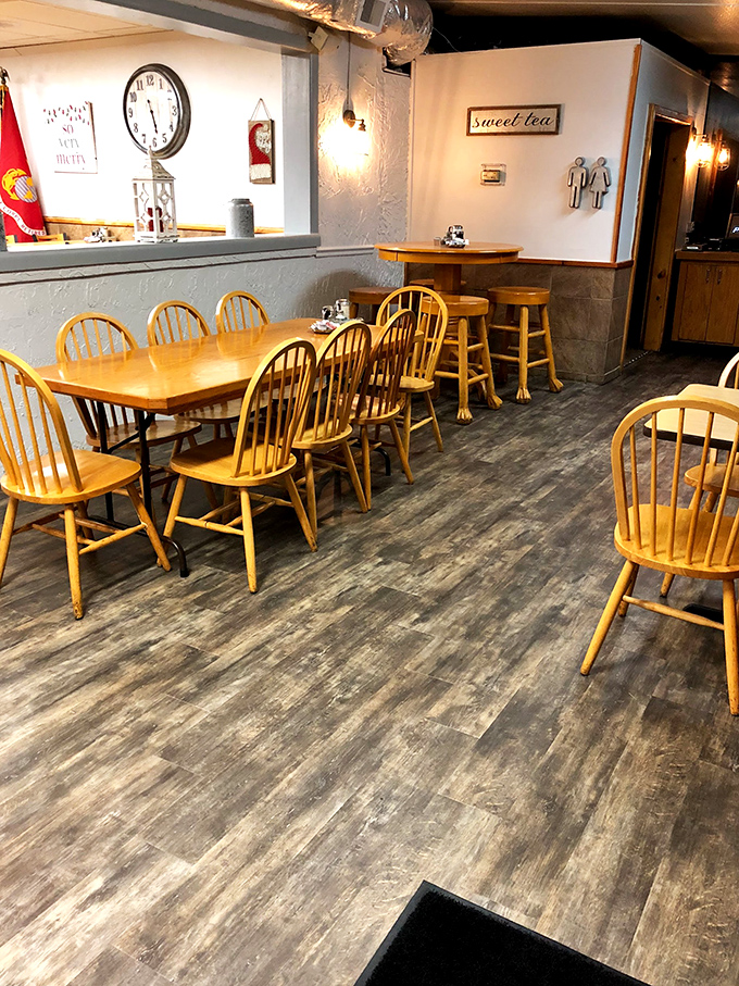 Simple wooden tables and classic chairs create the perfect backdrop for breakfast drama. The "Sweet Tea" sign reminds you you're firmly in the South.