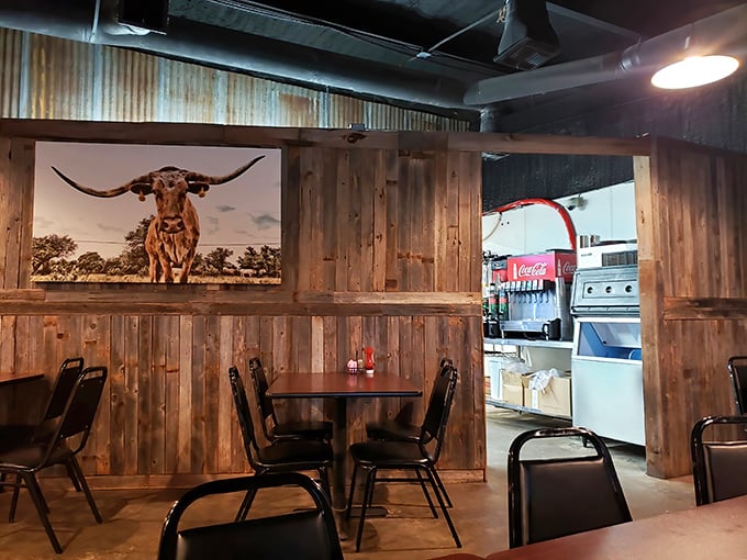 Rustic wooden walls display longhorn art&mdash;a reminder that your dinner's ancestors once roamed these very plains with considerably more attitude.