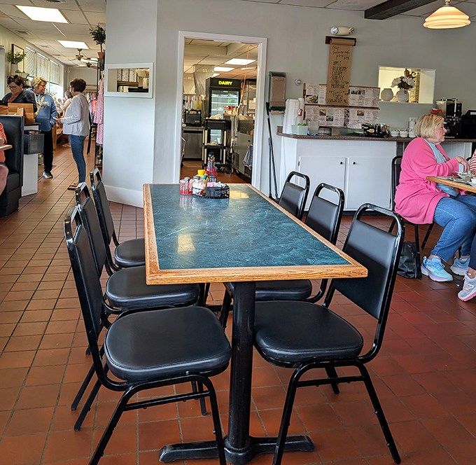 Long tables with green marble tops create the perfect setting for both intimate conversations and the spontaneous "you've got to try this" food-sharing moments.