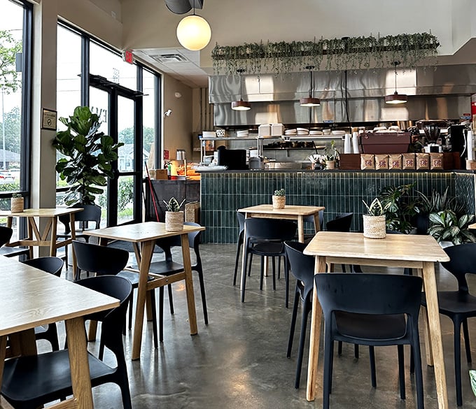 The dining room feels like the living room of that friend who has impeccable taste but never makes you feel underdressed. Plants add life; tile adds soul.