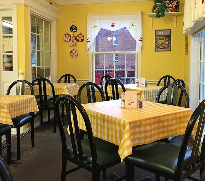 The yellow gingham tablecloths aren't just decor&mdash;they're a promise that comfort food and homestyle hospitality await at every table.