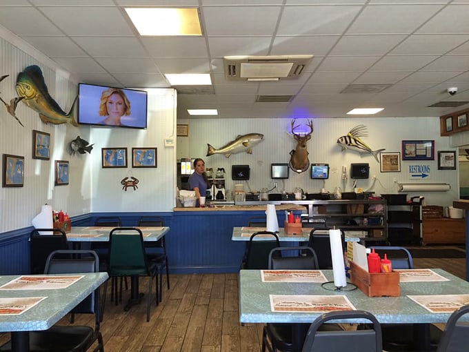 Blue wainscoting meets beach murals. The dining room feels like it was decorated by someone who actually knows the water, not a corporate designer.