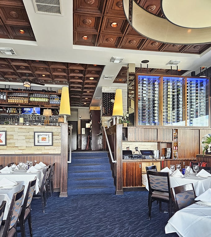 Multi-level dining with a view at every turn. The rich wood details and blue carpeting create a nautical vibe without going overboard.