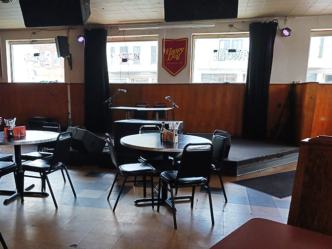 A stage awaits performers while diners enjoy their creative concoctions. Where else can you get dinner, drinks, and entertainment all centered around the humble hot dog?