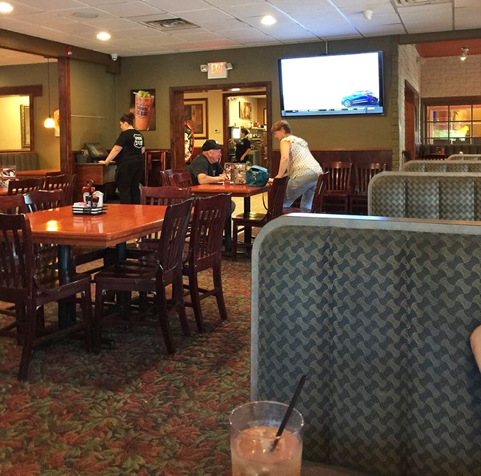 That perfect balance of cozy booths and open spaces where conversations bloom like flowers and servers navigate with the grace of ballet dancers.