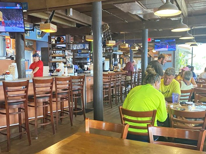 The bar beckons with promises of cold drinks and easy conversation, where NASA engineers might sit next to commercial fishermen.
