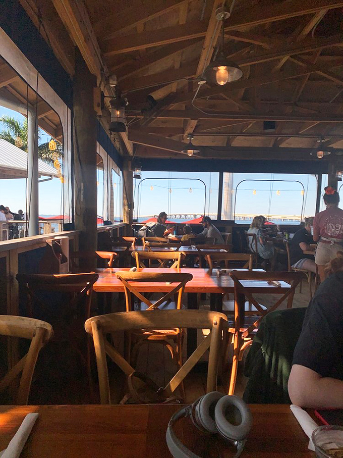 Golden hour transforms this dining room into a cathedral of casual coastal cuisine. Prayers answered, hunger banished.