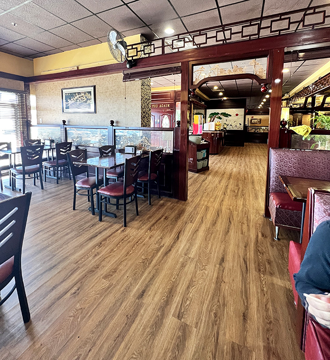 Warm wood tones and thoughtful dividers create intimate dining spaces, proving buffets can be about atmosphere as well as abundance.