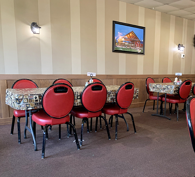 Red chairs wait patiently for the next round of hungry pilgrims. This isn't just eating out &ndash; it's communal therapy with carbs.