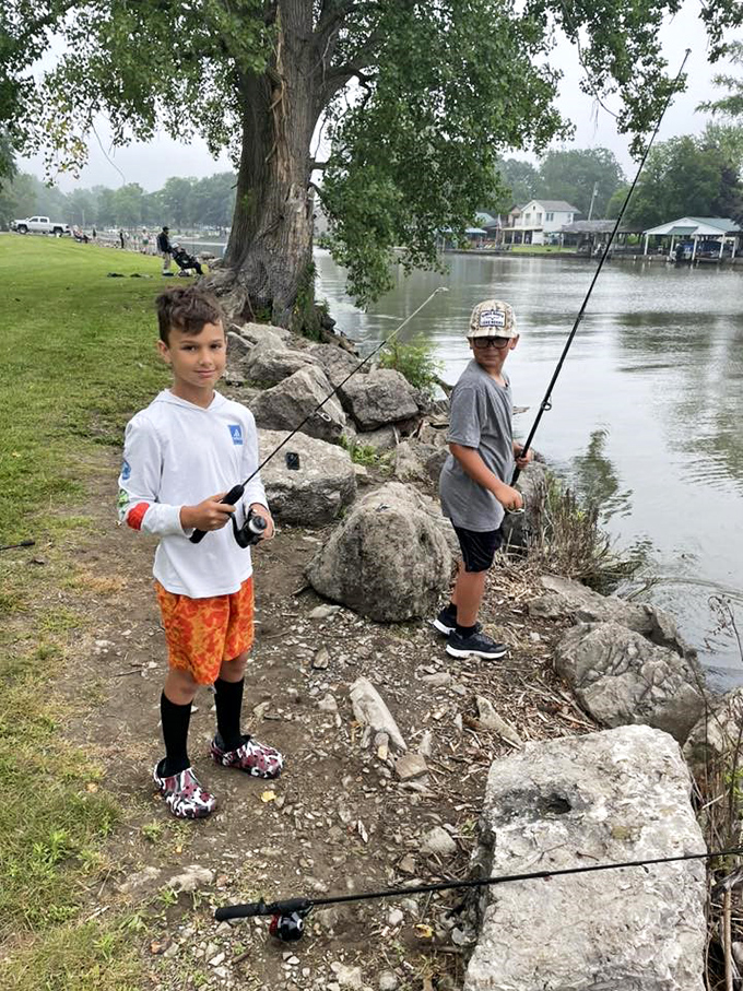 Future fishing champions testing their patience and skills along the rocky shoreline &ndash; creating memories that will outlast whatever's in their tackle box.